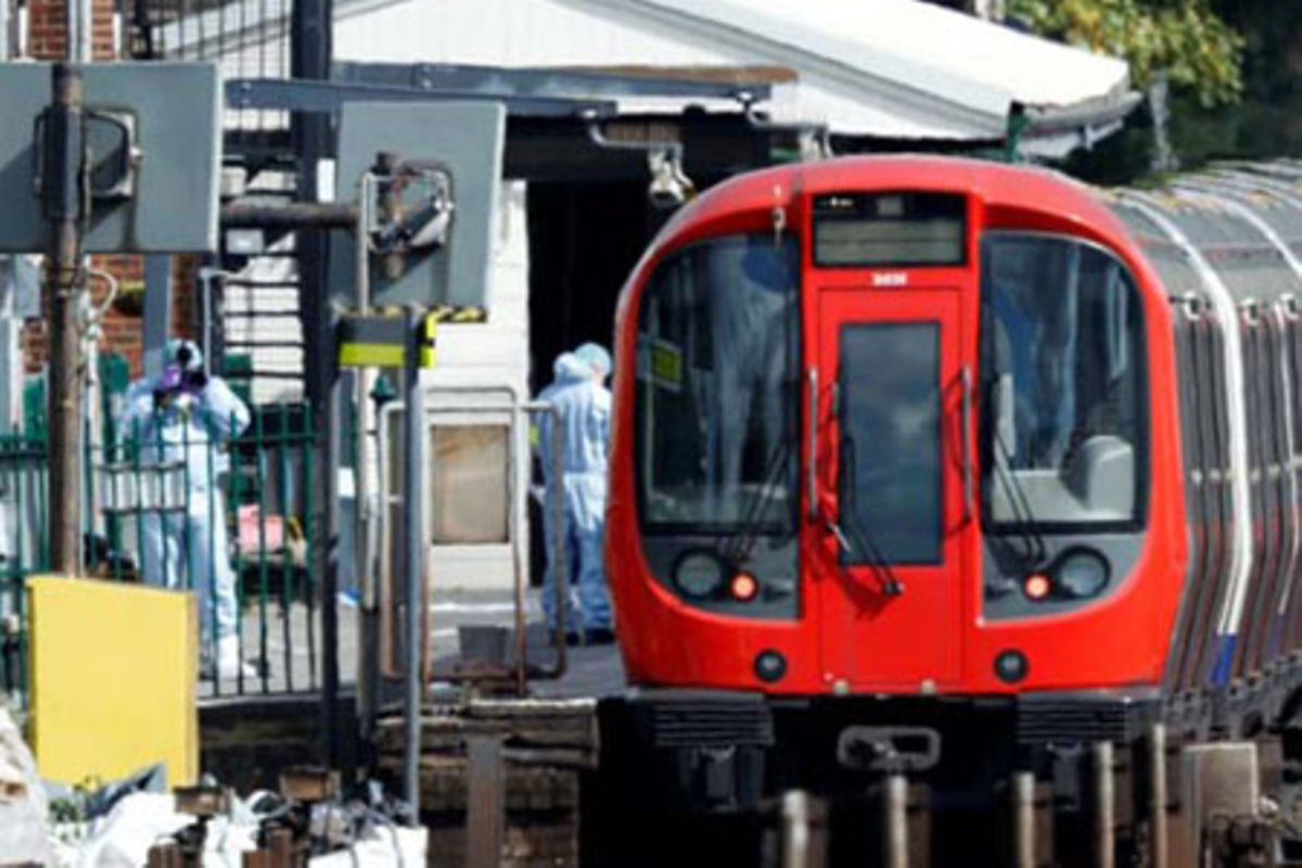 Police arrest teenager over London train attack, hunt for other ...