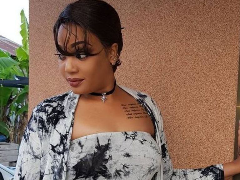 Actress Irene Uwoya throws cash at journalists at the launch of Swahili ...